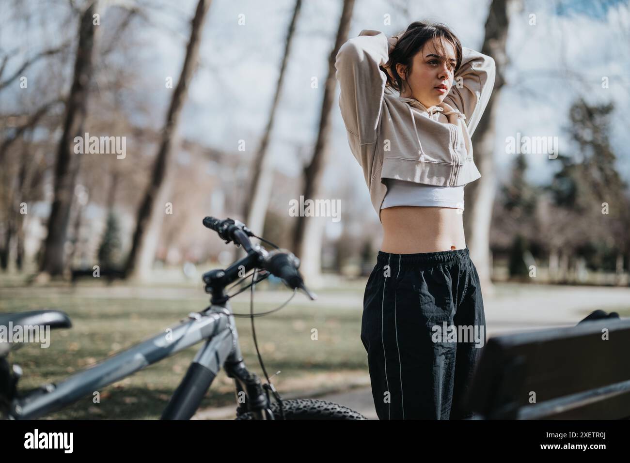 Woman stretching before bike hi-res stock photography and images - Alamy