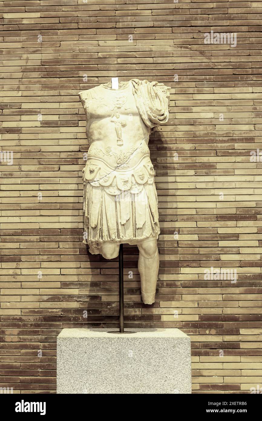 A marble statue of a Roman emperor in military dress, highlighting ...