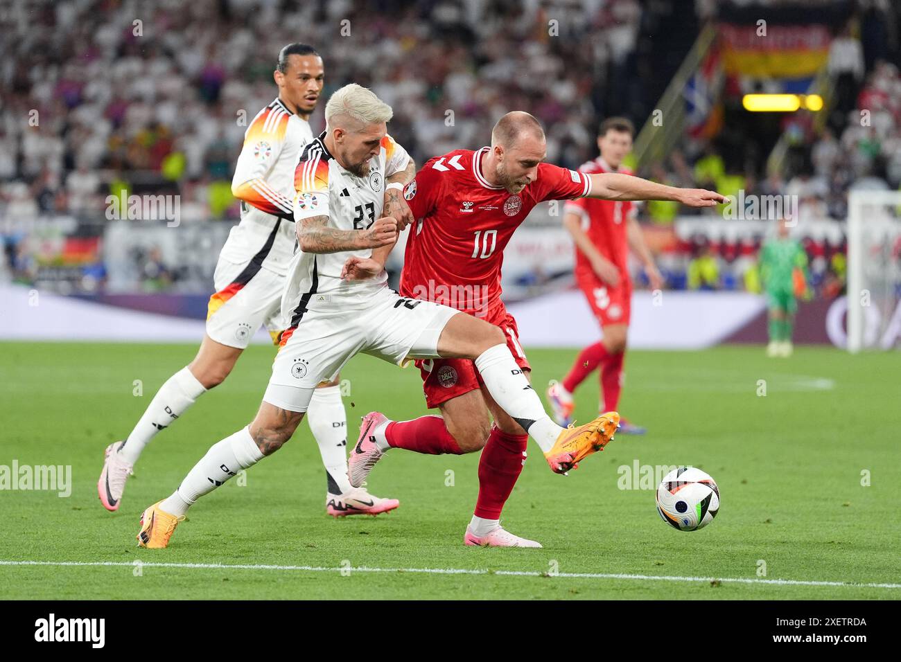 Germany's Robert Andrich and Denmark's Christian Eriksen battle for the ...