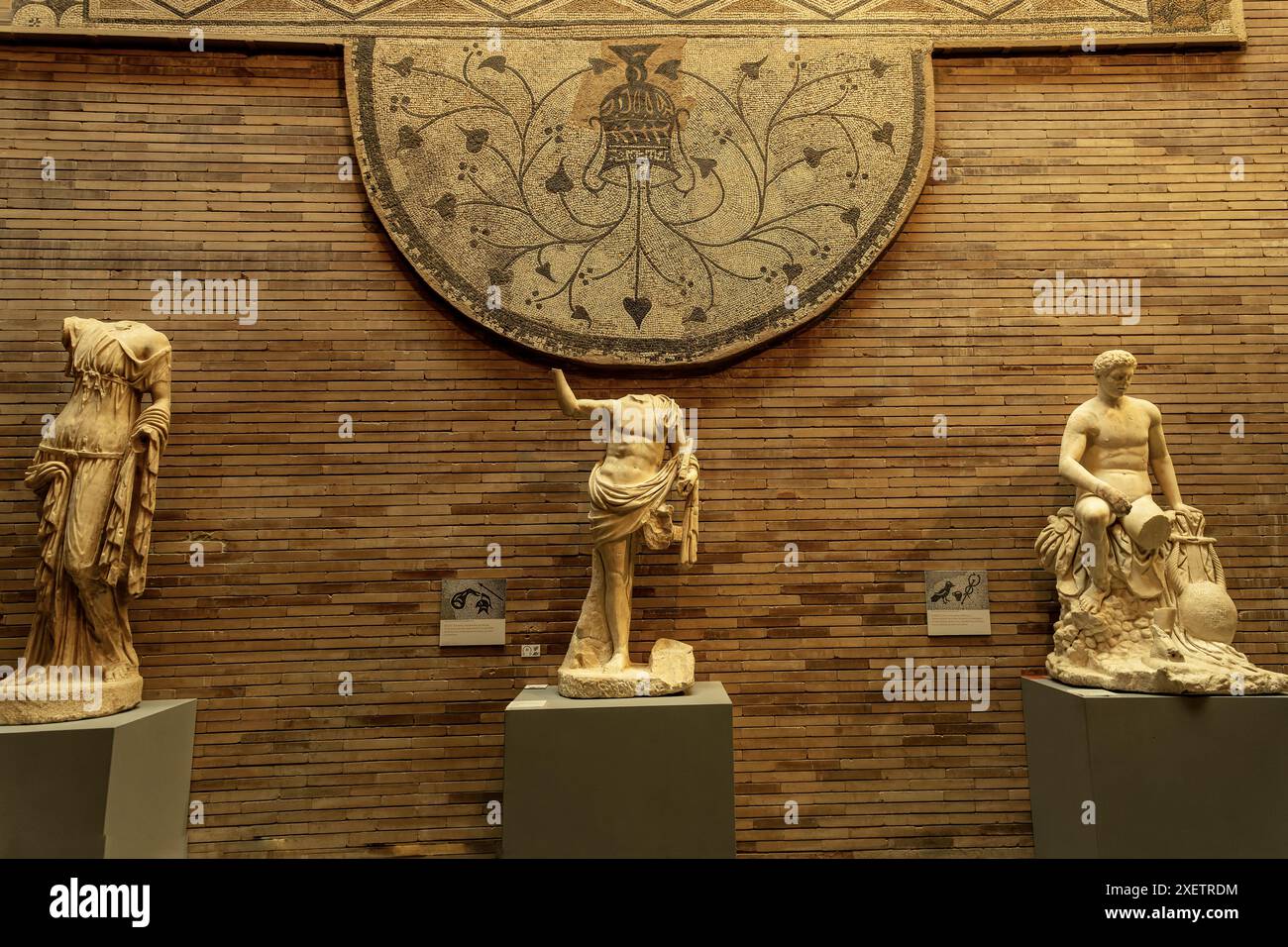 Three ancient Roman statues displayed in the Merida Museum, Spain, with ...