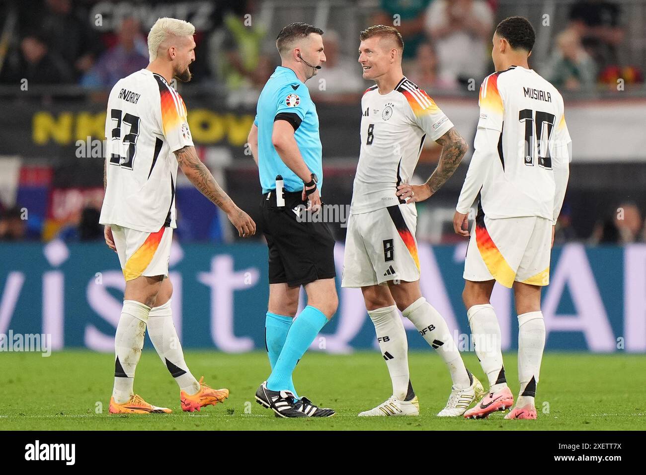 Match referee Michael Oliver speaks with Germany's Toni Kroos before ...
