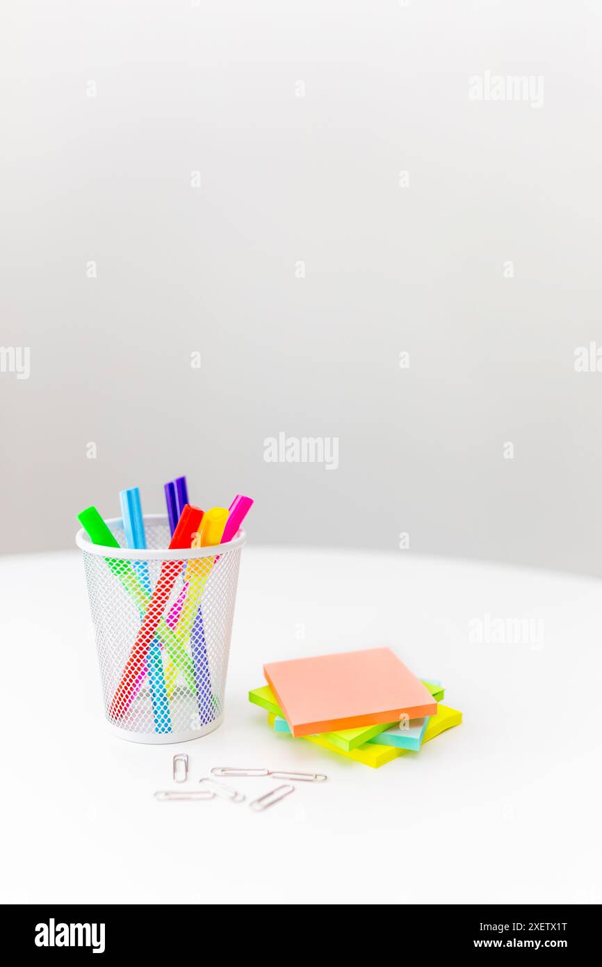 Office desk table with supplies, sticky notes and coloured pens. Top ...