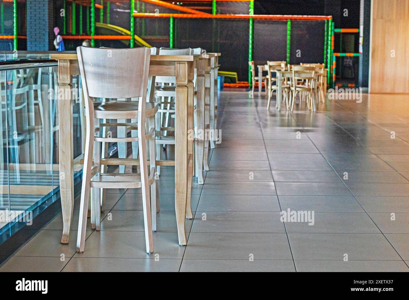 bar tables and tables in the interior near the cinema. Modern interior ...