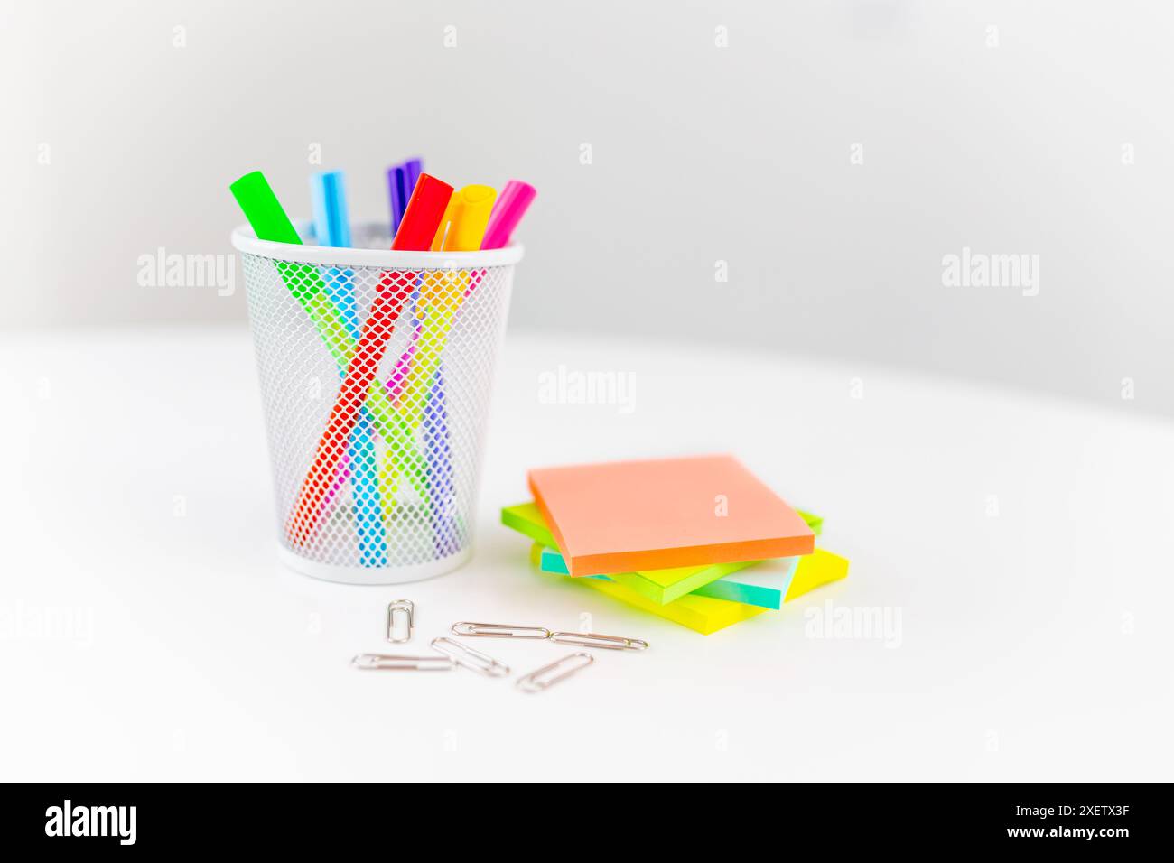 Office desk table with supplies, sticky notes and coloured pens. Top ...