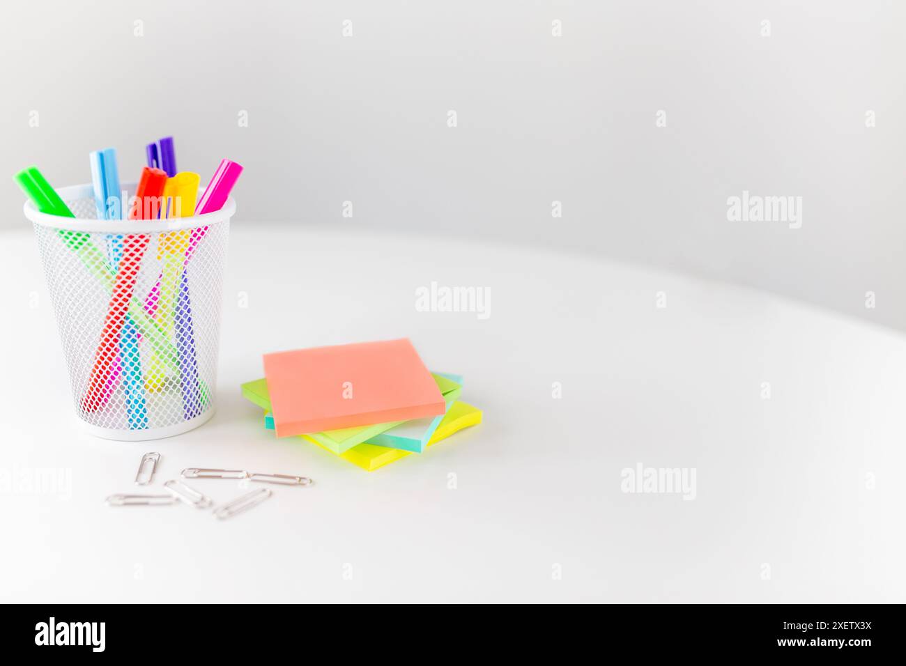 Office desk table with supplies, sticky notes and coloured pens. Top ...