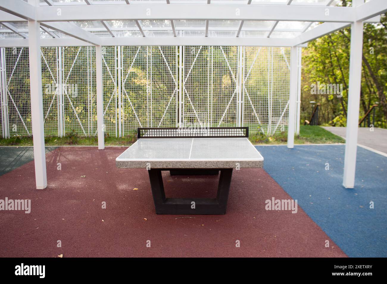 Green ping-pong table and net outdoors. sunny summer day Stock Photo ...
