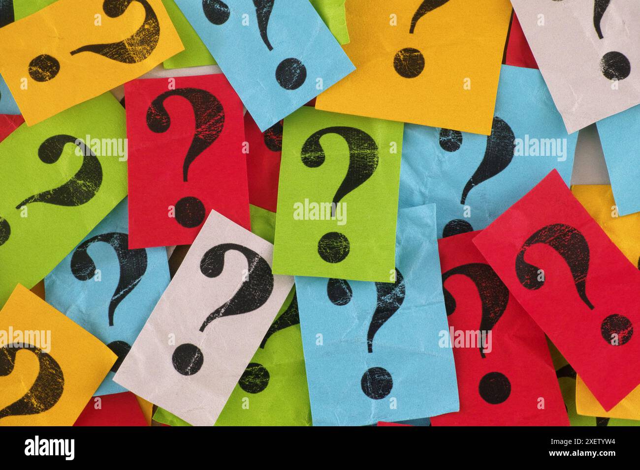 Too Many Questions. A pile of colorful paper notes with question marks ...