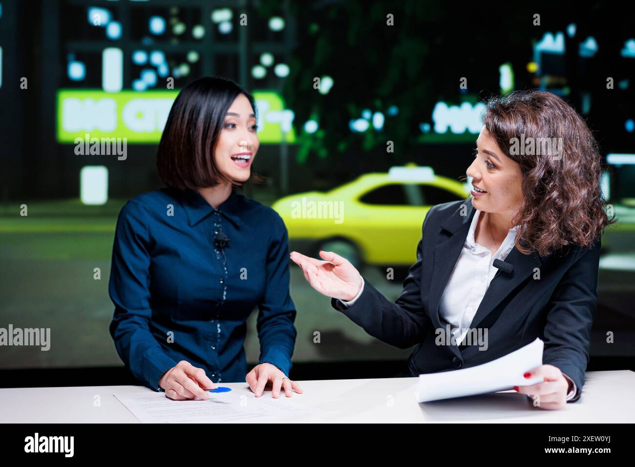 Diverse team reading latest headlines in newsroom, covering all ...