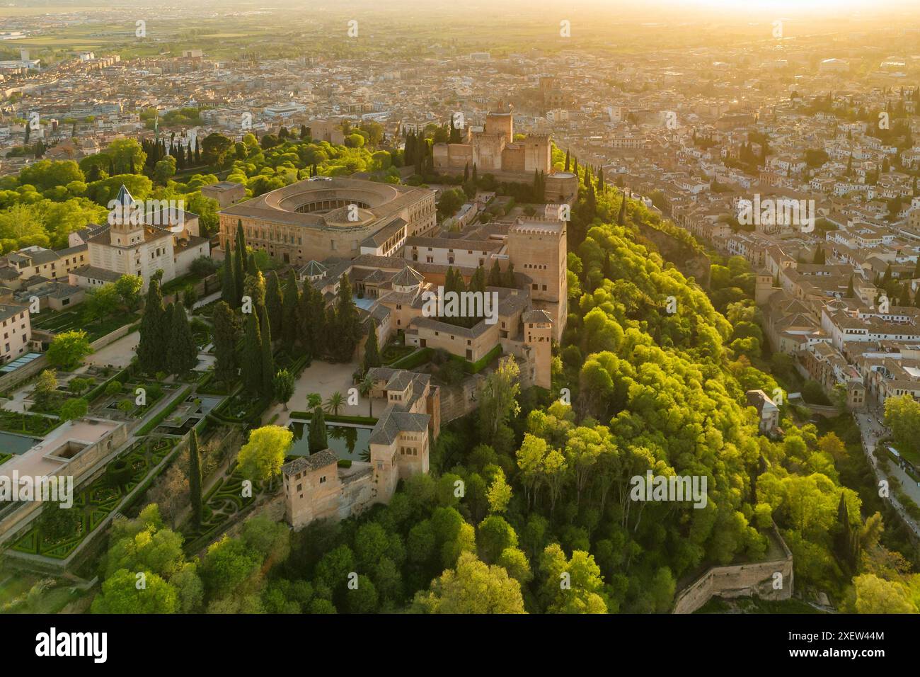 Aerial view of the Alhambra palace at sunset in Granada, Andalusia ...