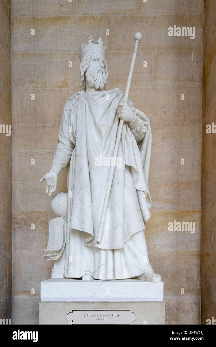 White stone statue of historical character in the palace of Versailles ...