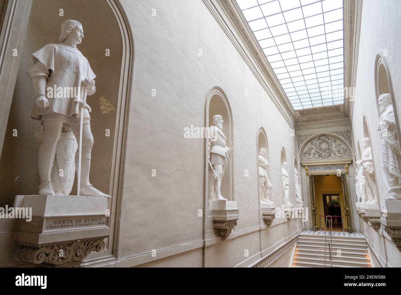 White stone statue of historical character in the palace of Versailles ...