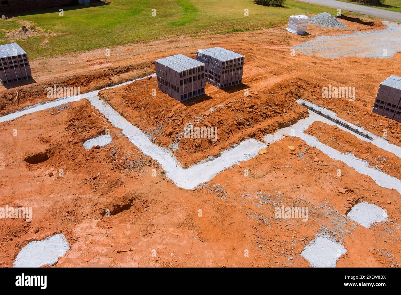 Building blocks delivered to construction site with foundations ready ...