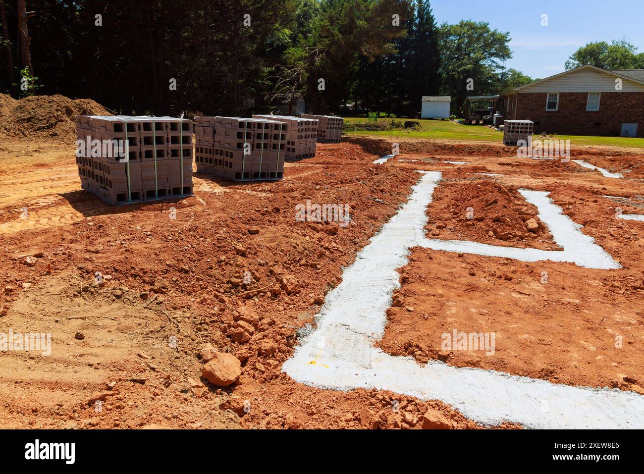 Concrete blocks delivered to construction site with foundation is ready ...
