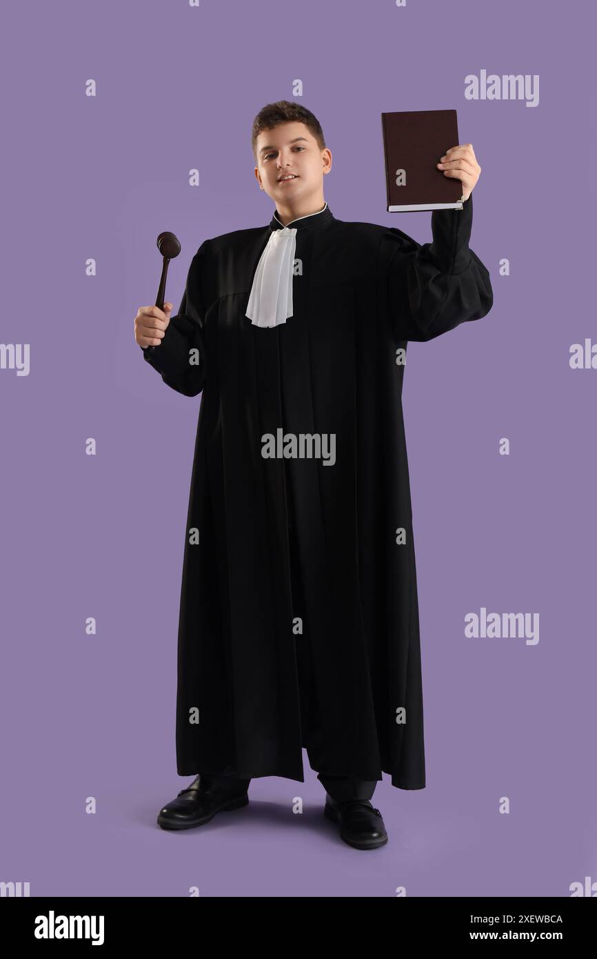 Teenage judge with law book and gavel on lilac background Stock Photo ...
