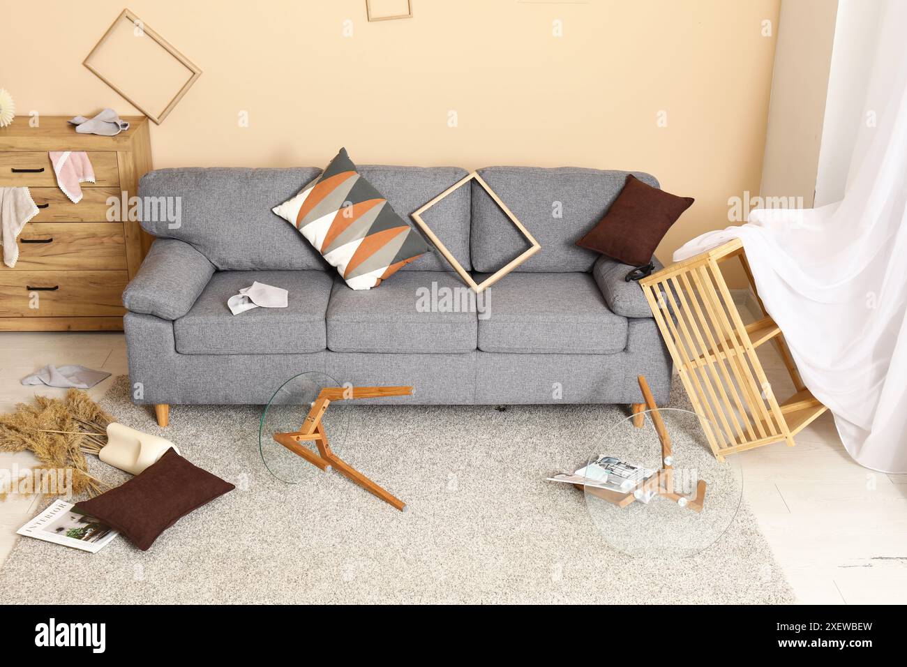 Interior of living room with grey sofa after strong earthquake Stock ...