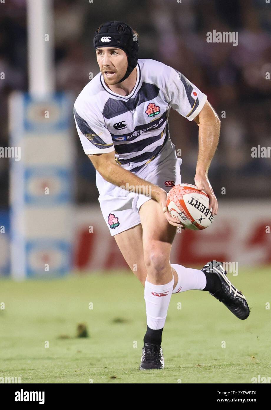 Tokyo, Japan. 29th June, 2024. Japan's center Nicholas McCurran passes ...