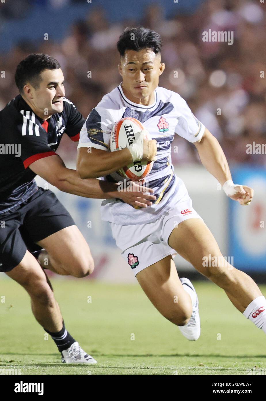 Tokyo, Japan. 29th June, 2024. Japan's center Tomoki Osada carries the ball during an ...