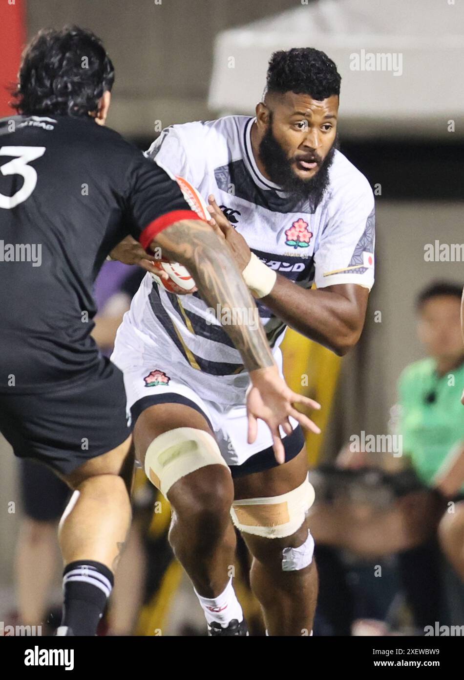 Tokyo, Japan. 29th June, 2024. Japan's lock Sanaila Waqa carries the ...