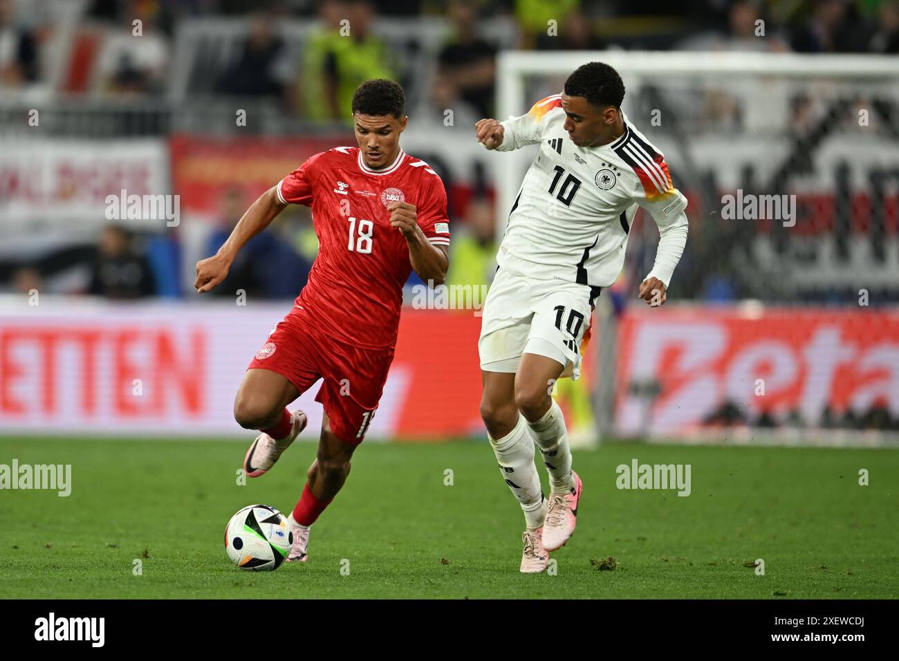 Alexander Bah (Denmark)Jamal Musiala (Germany) during the UEFA Euro ...