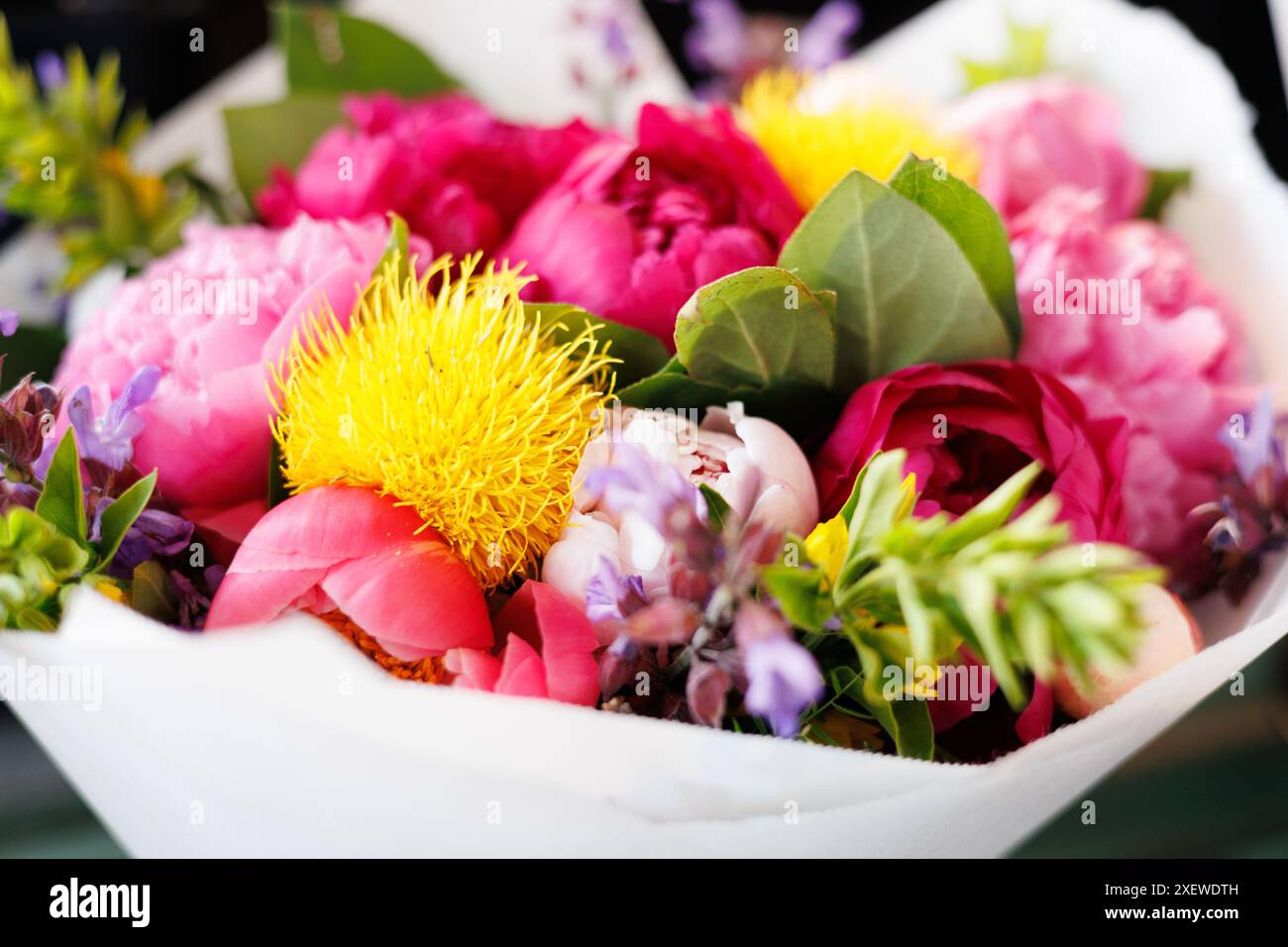 Vibrant arrangement of various colorful flowers hi-res stock ...