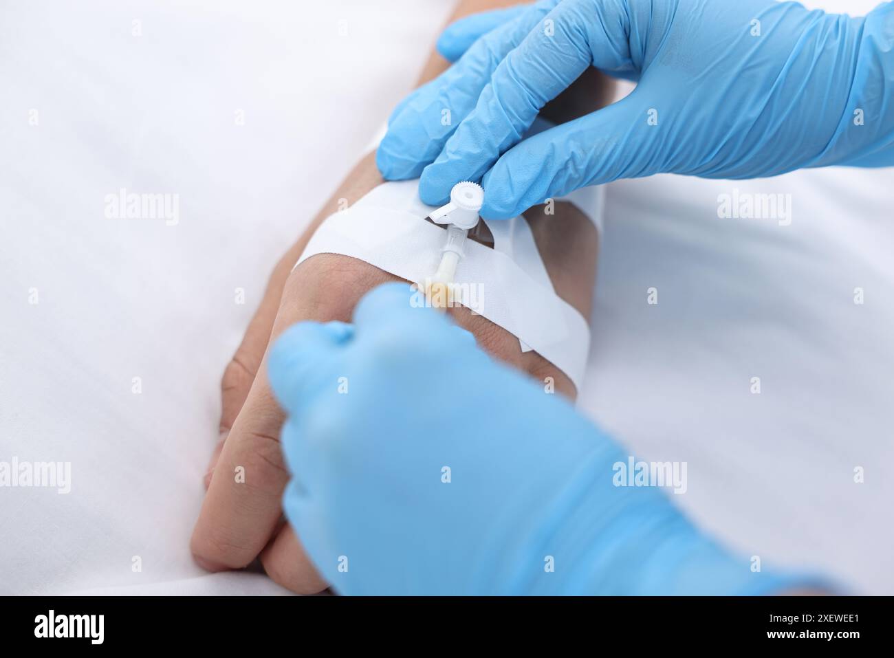Nurse inserting iv arm hi-res stock photography and images - Alamy