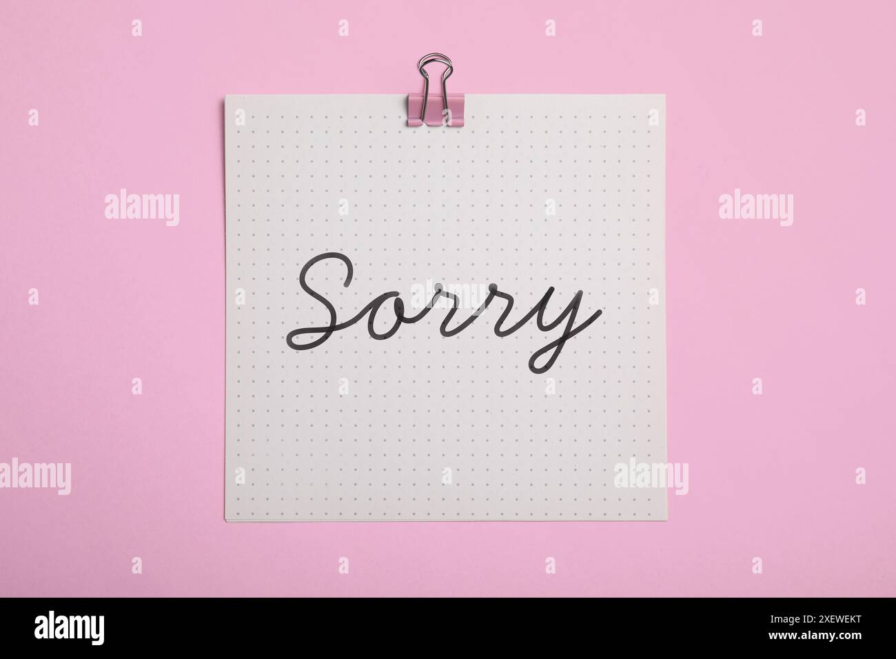 Sorry paper note on pink background, top view Stock Photo - Alamy