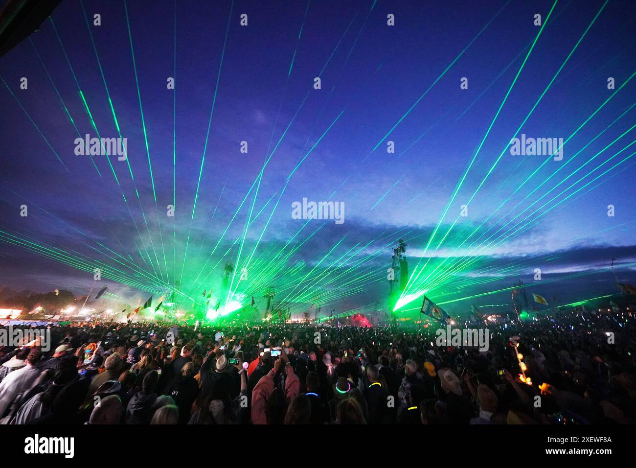 The crowd watching Coldplay performing on the Pyramid Stage at the ...