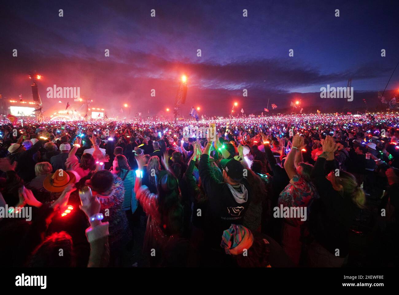 The crowd watching Coldplay performing on the Pyramid Stage at the ...
