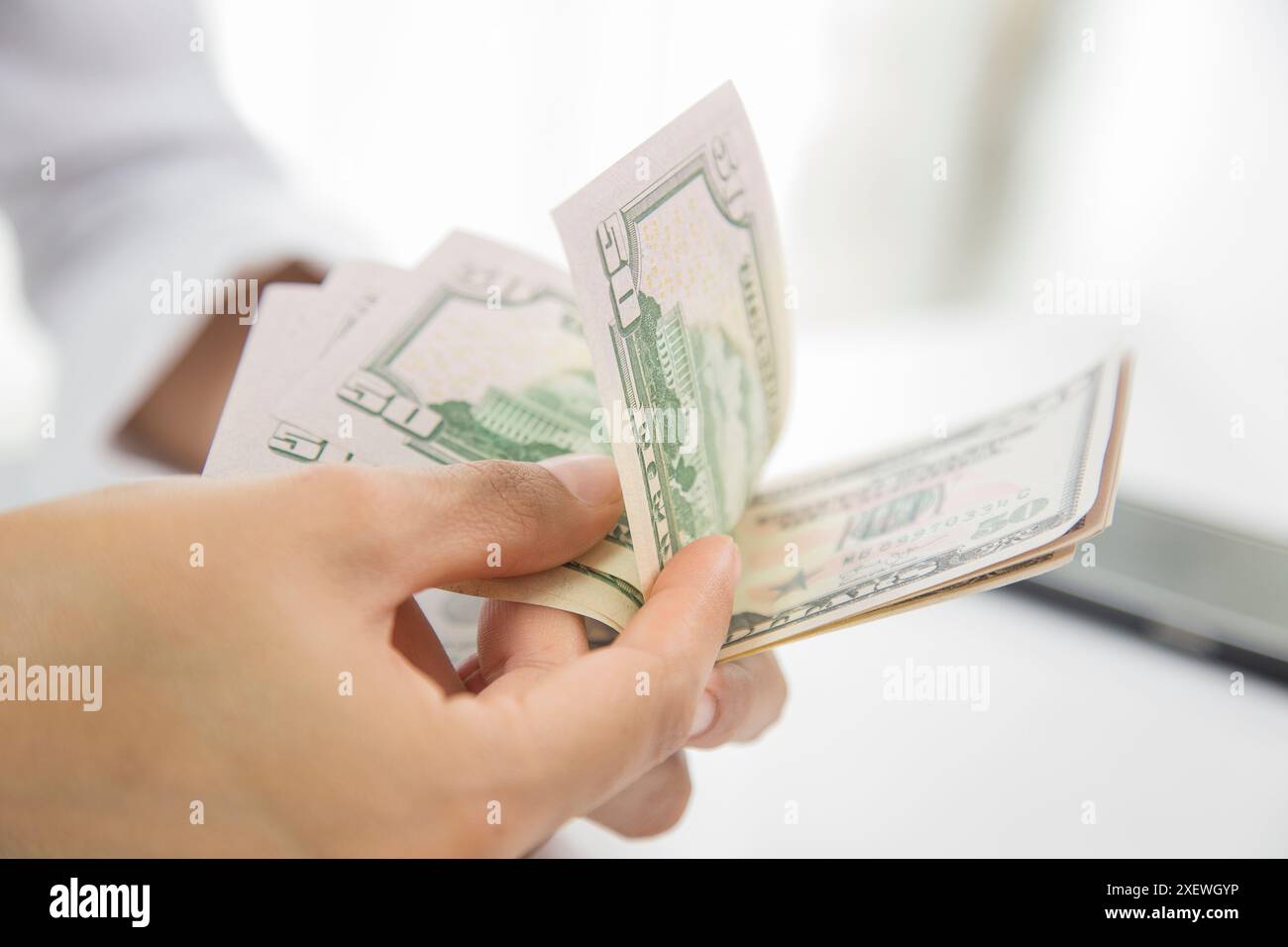 Hands holding american dollar hi-res stock photography and images - Alamy