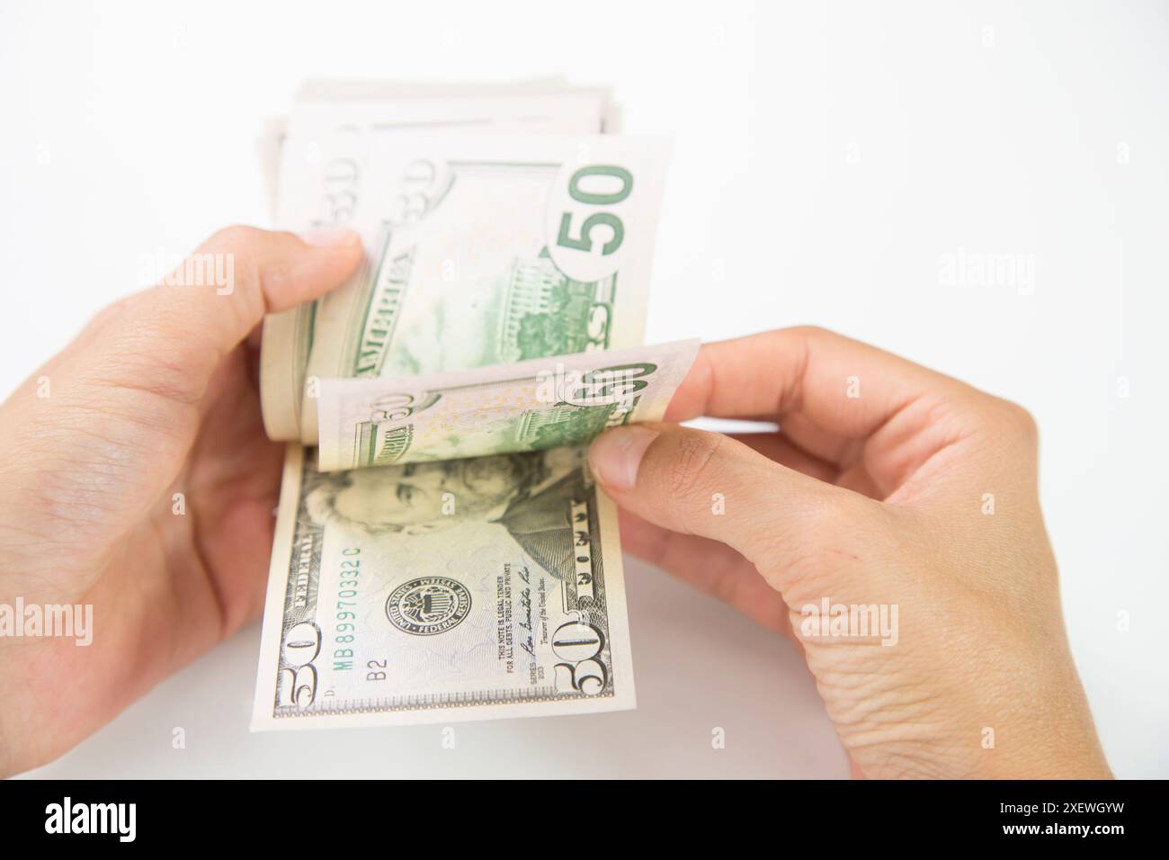 Counting dollar banknotes in hand hi-res stock photography and images ...