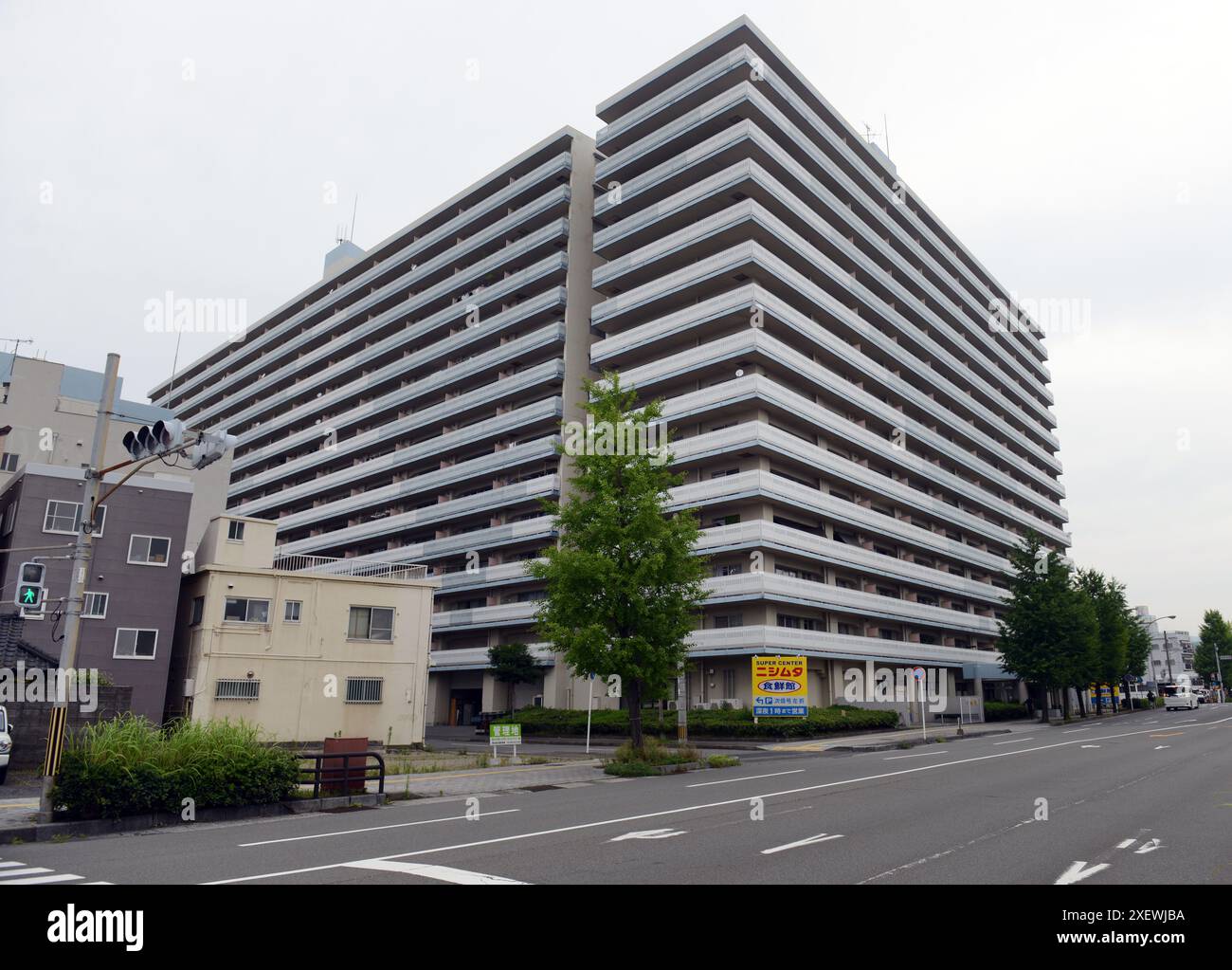 A large rectangle residential building near the waterfront in Kagoshima ...