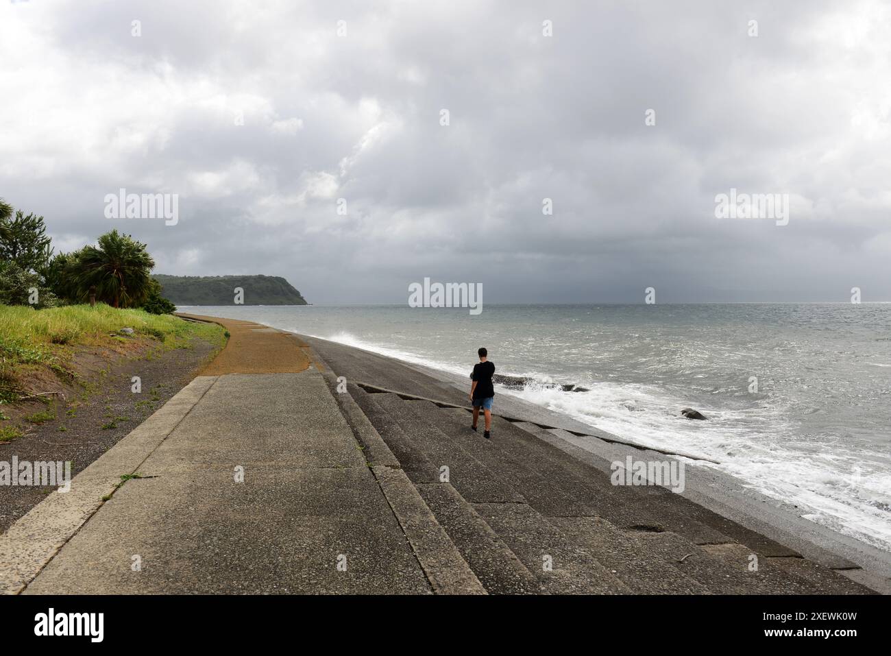 Walking along the waterfront promenade in the HIgashikata park in north ...