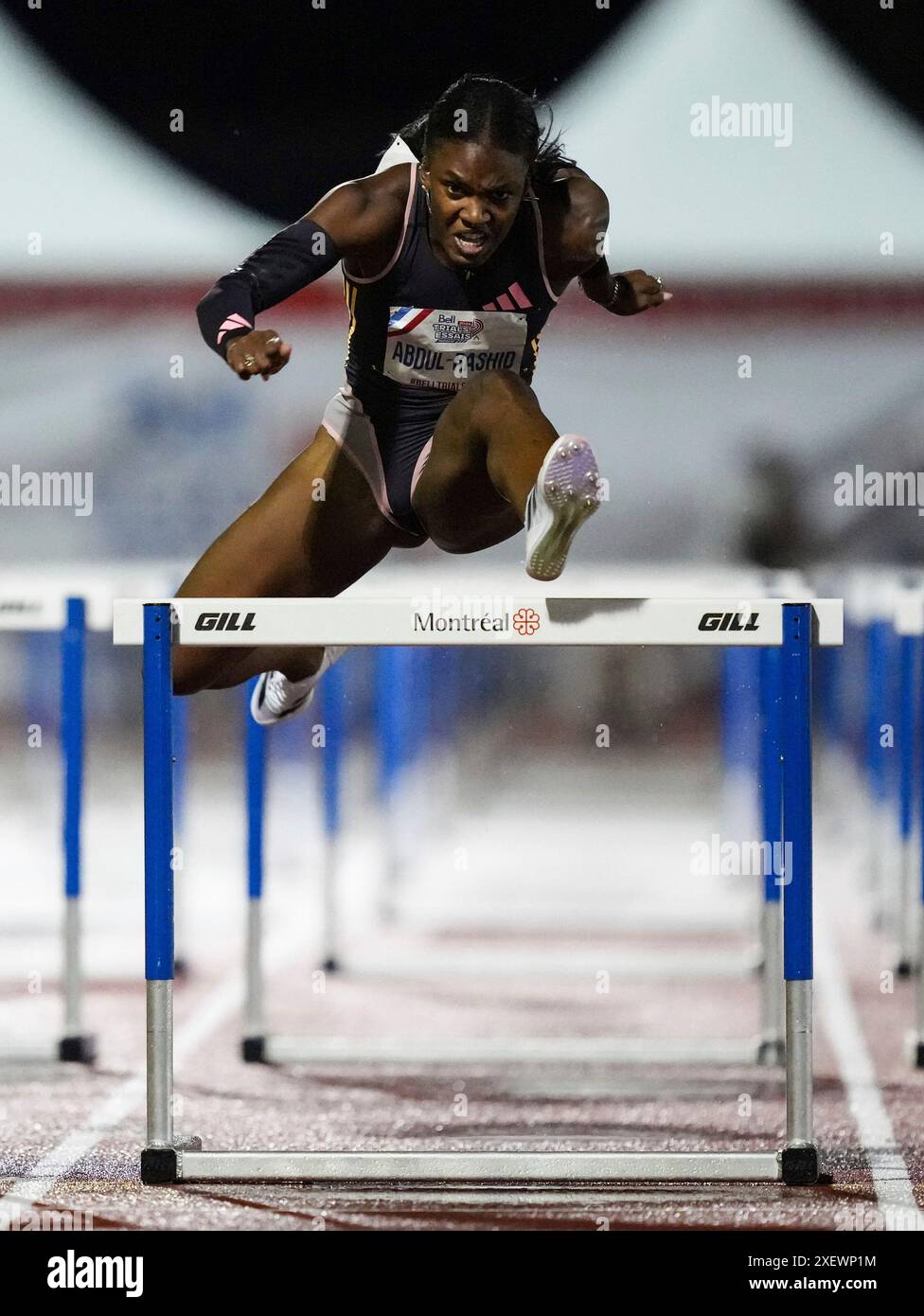 Mariam Abdul-Rashid competes to win the women's 100-meter hurdles final ...