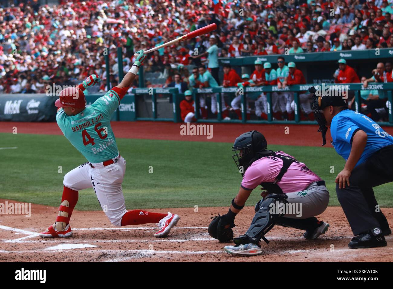 Jose Marmolejos #46 of Diablos Rojos hits the ball during the match 2 ...