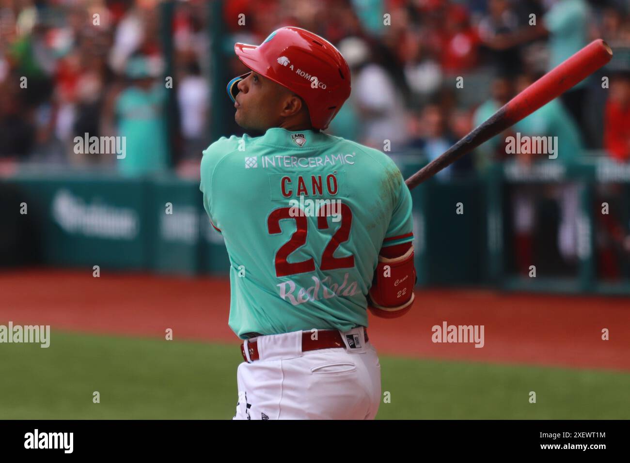 Robinson Cano #22 of Diablos Rojos hits the ball during the match 2 of ...