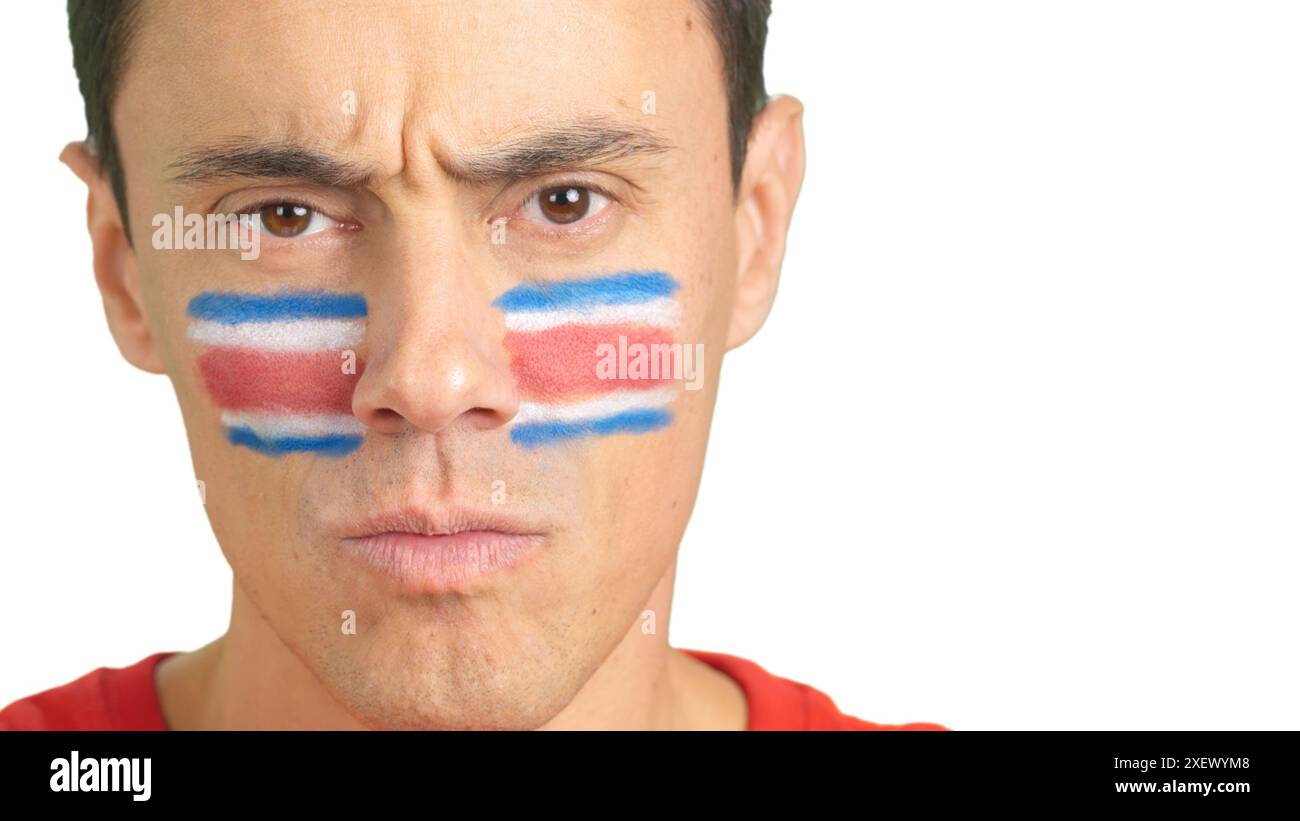 Serious man with a costa rican flag painted on the face Stock Photo - Alamy