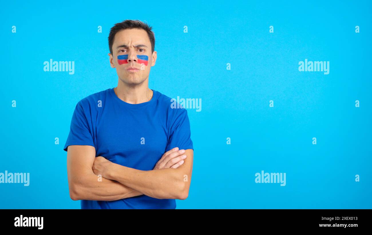Dignified and serious man with haitian flag painted on face Stock Photo ...