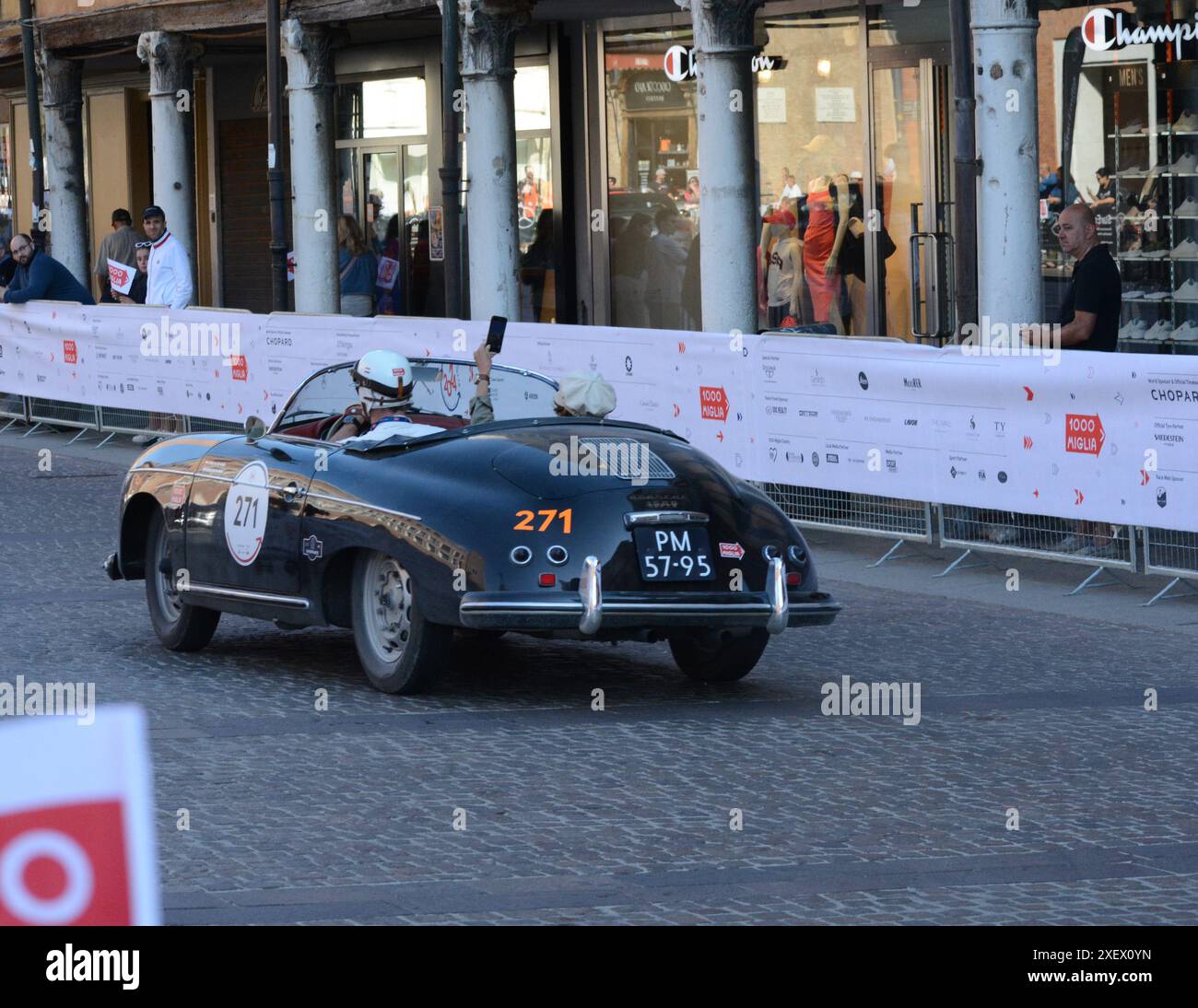 FERRARA , ITALY - jun 15 -2024 : A classic car races through the ...
