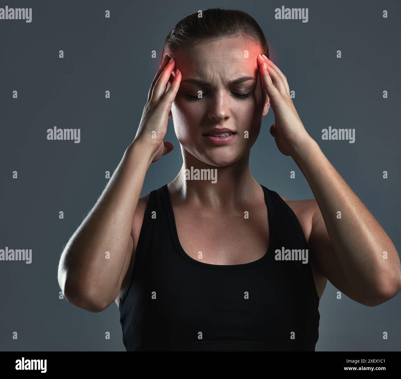 Fitness, headache and sports woman in studio on gray background with ...