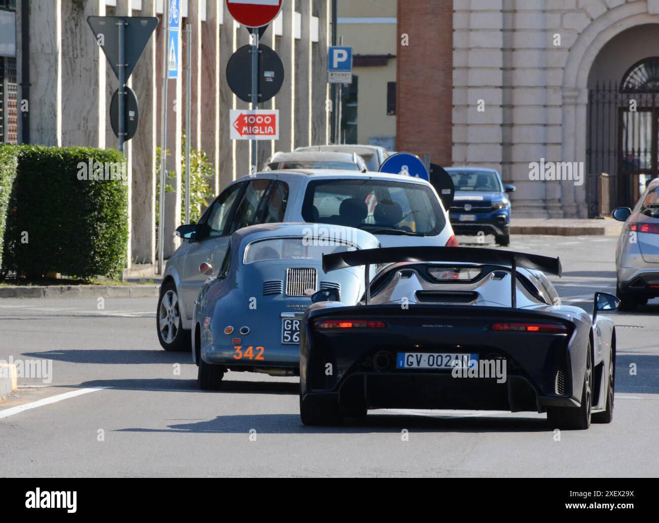 FERRARA , ITALY - jun 15 -2024 : A classic car races through the ...