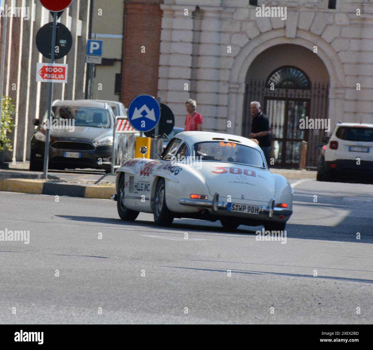 FERRARA , ITALY - jun 15 -2024 : A classic car races through the ...
