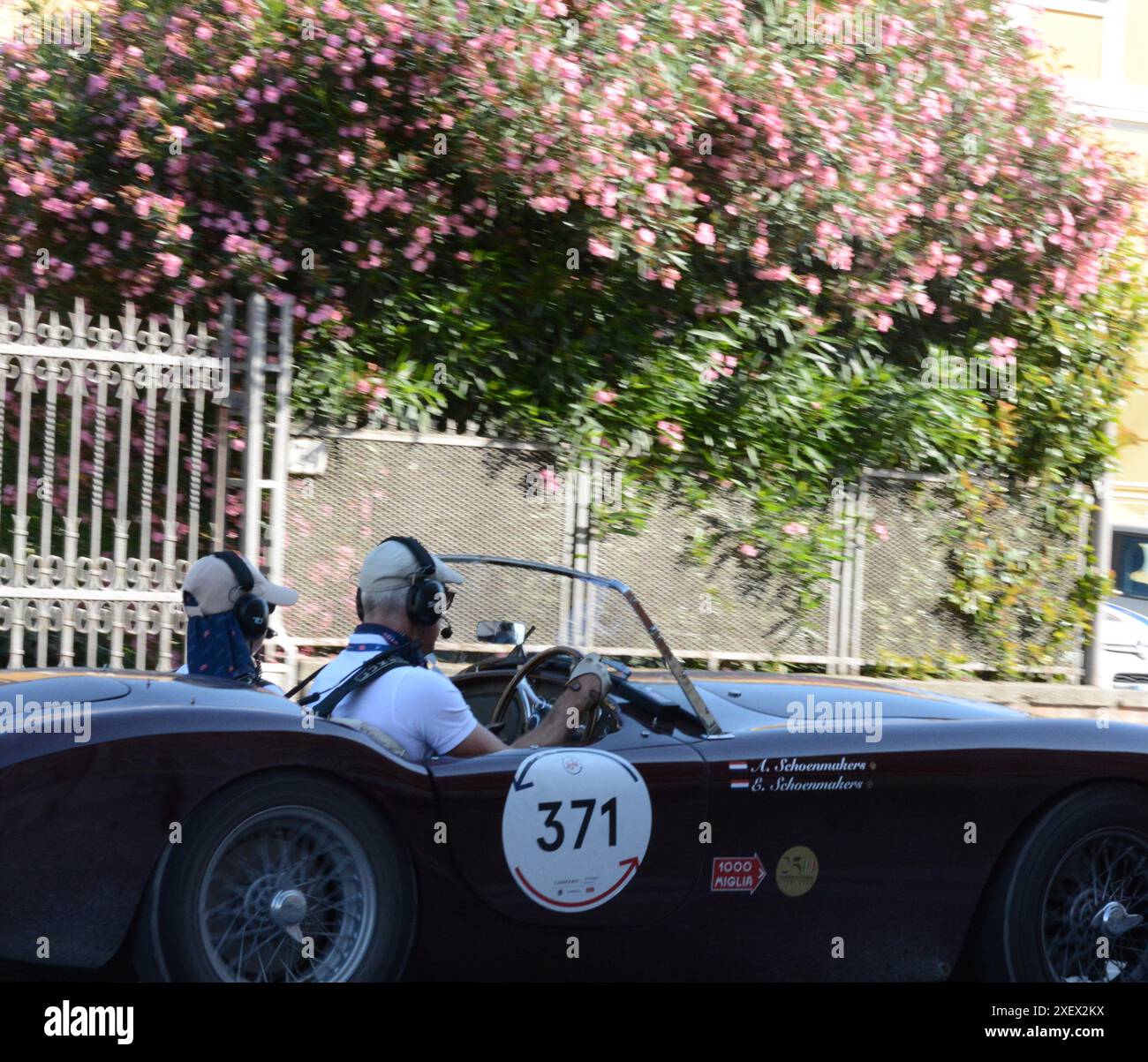 FERRARA , ITALY - jun 15 -2024 : A classic car races through the ...