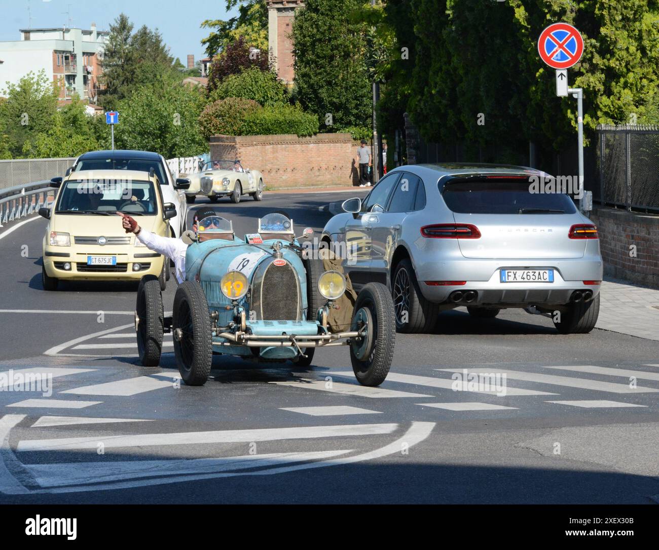FERRARA , ITALY - jun 15 -2024 : A classic car races through the ...