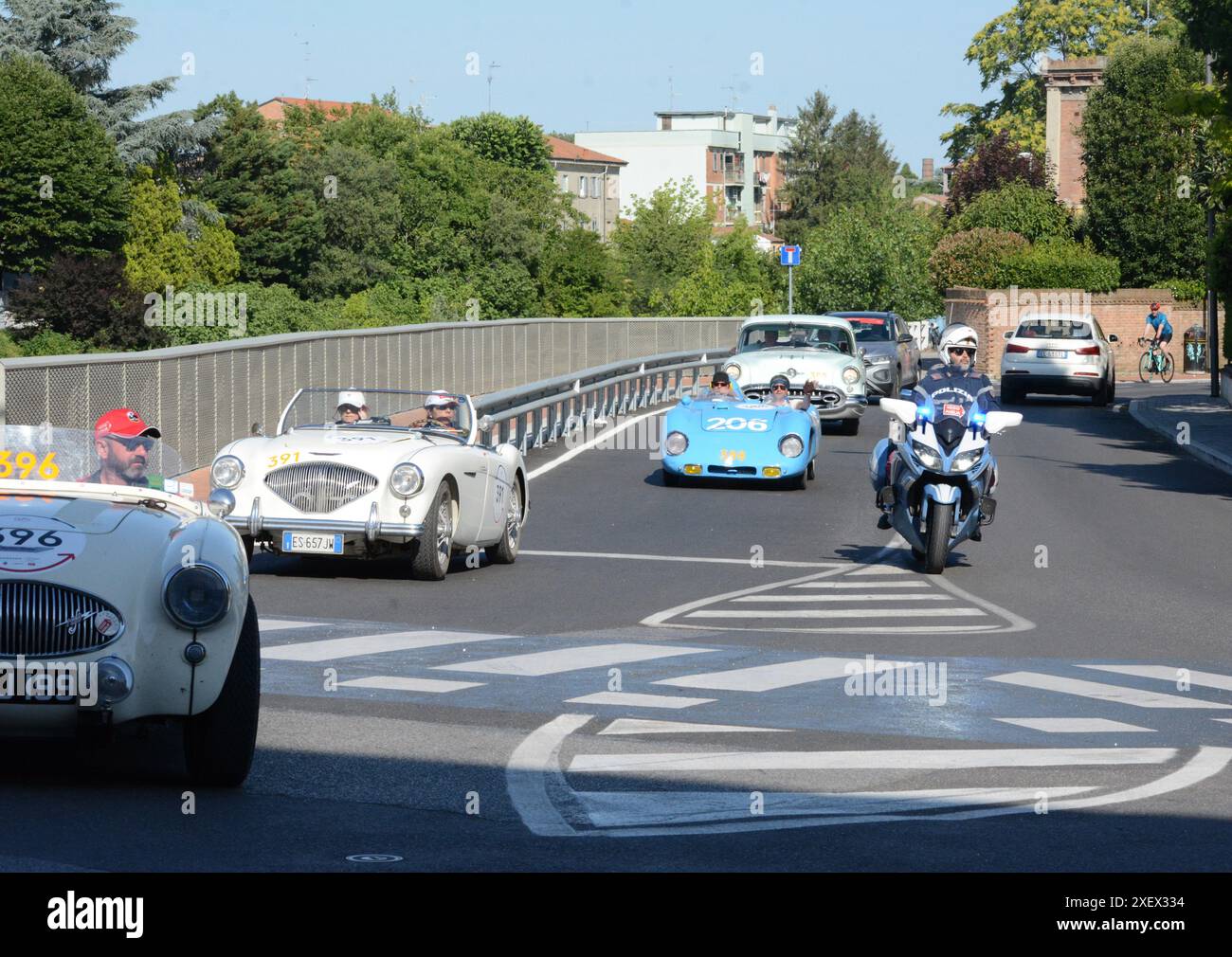 FERRARA , ITALY - jun 15 -2024 : A classic car races through the ...