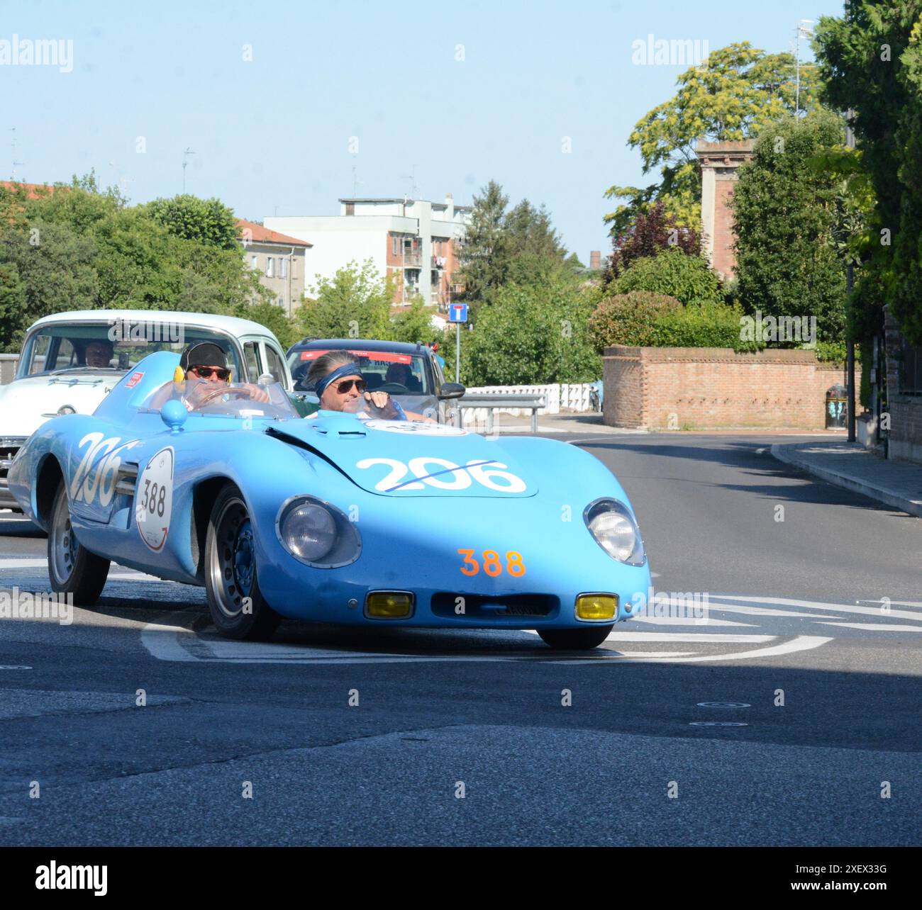 FERRARA , ITALY - jun 15 -2024 : A classic car races through the ...