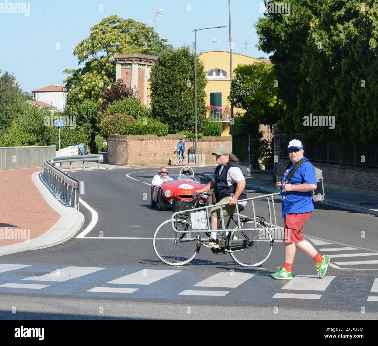 FERRARA , ITALY - jun 15 -2024 : A classic car races through the ...