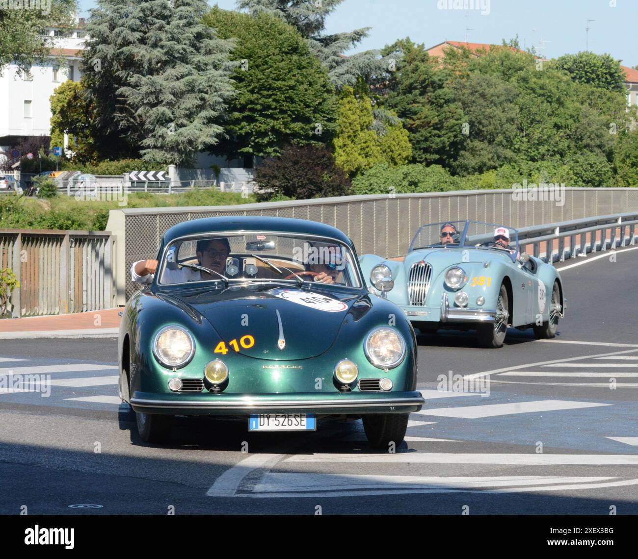 FERRARA , ITALY - jun 15 -2024 : A classic car races through the ...