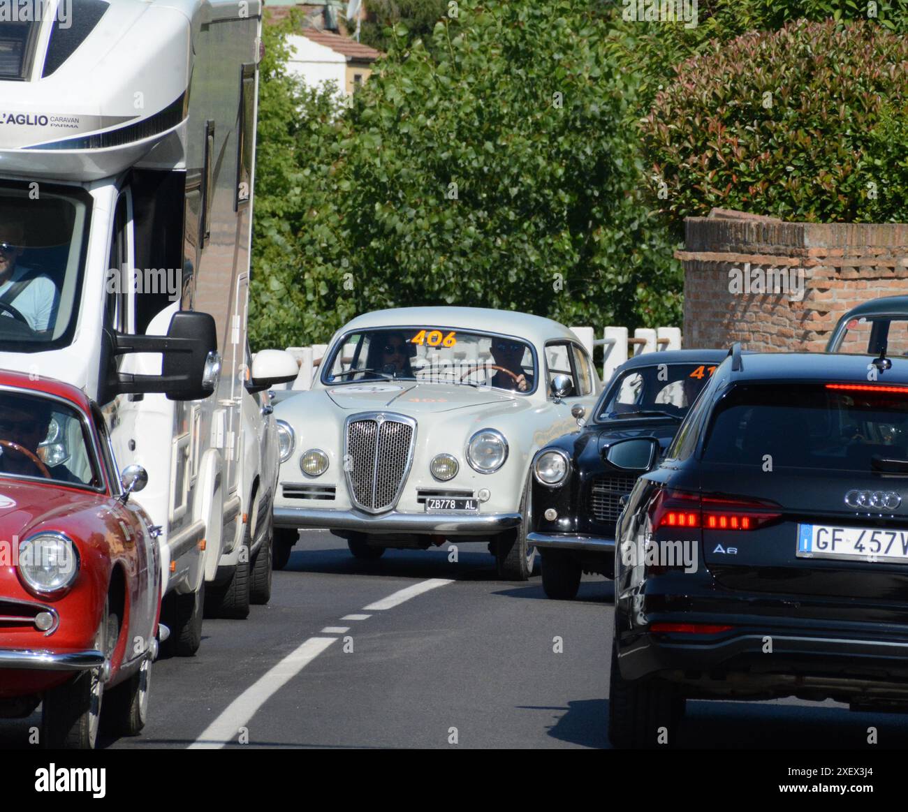 FERRARA , ITALY - jun 15 -2024 : A classic car races through the ...