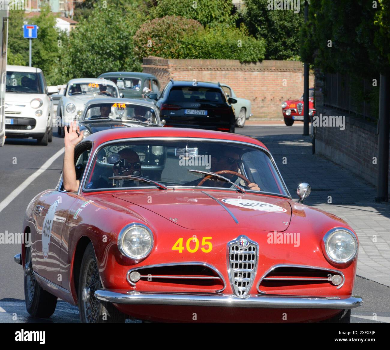 FERRARA , ITALY - jun 15 -2024 : A classic car races through the ...