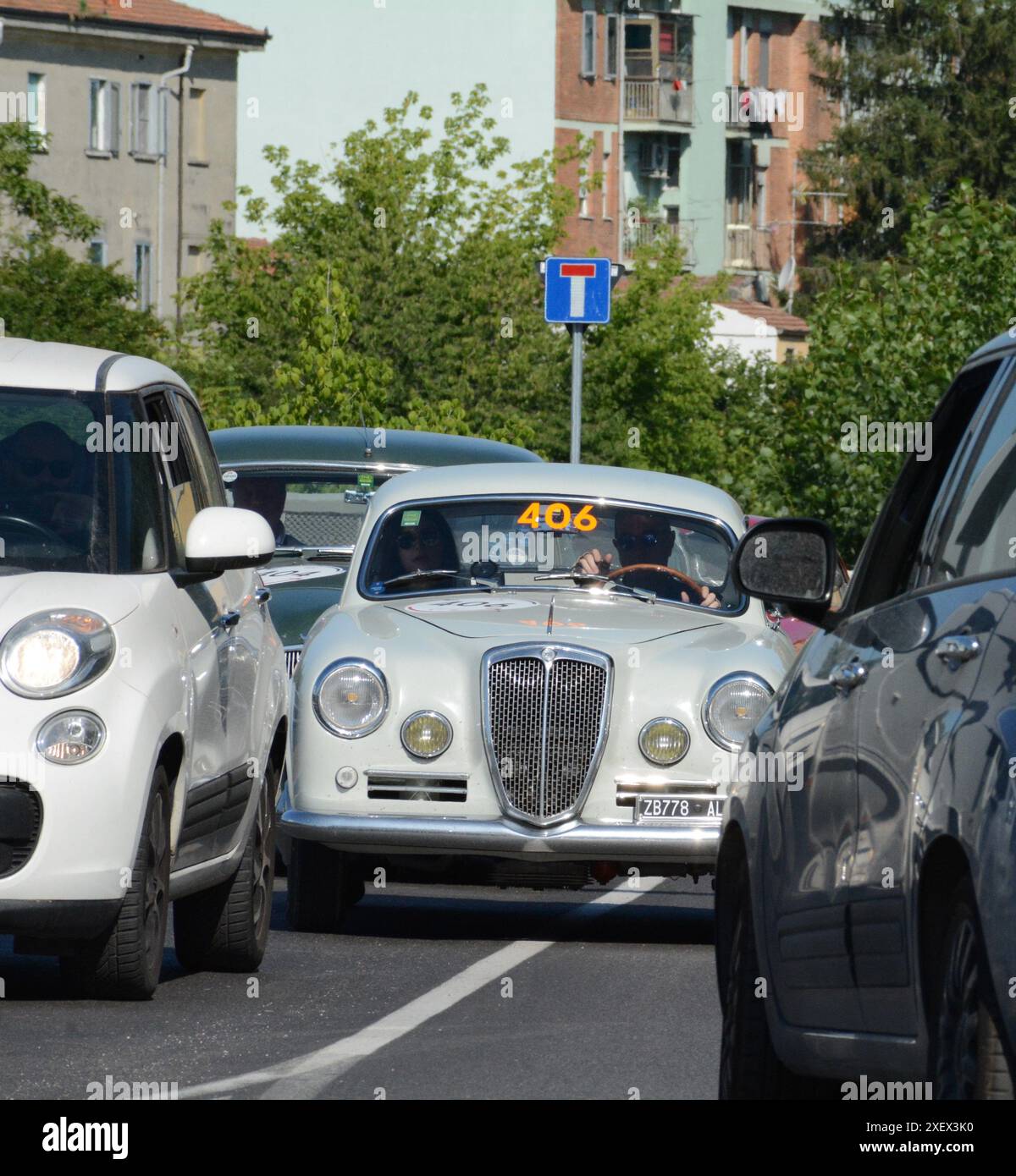FERRARA , ITALY - jun 15 -2024 : A classic car races through the ...